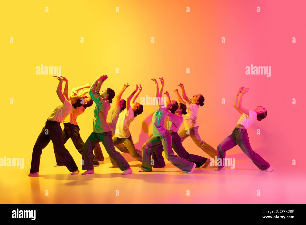 Group of beautiful teenage girls wearing white t-shirt, jeans dancing ...