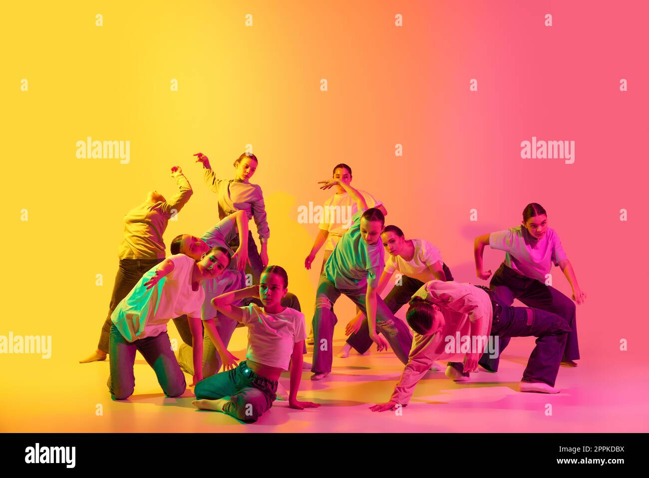 Group of young people, girls dancing contemp with different pose ...