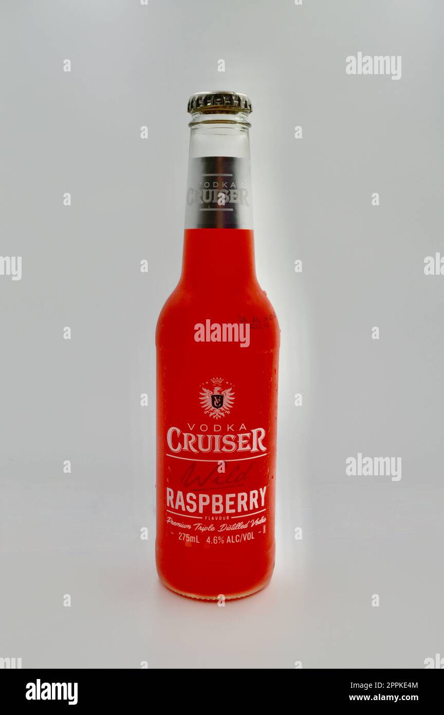 A bottle of Vodka Cruiser wild raspberry flavor against a white ...