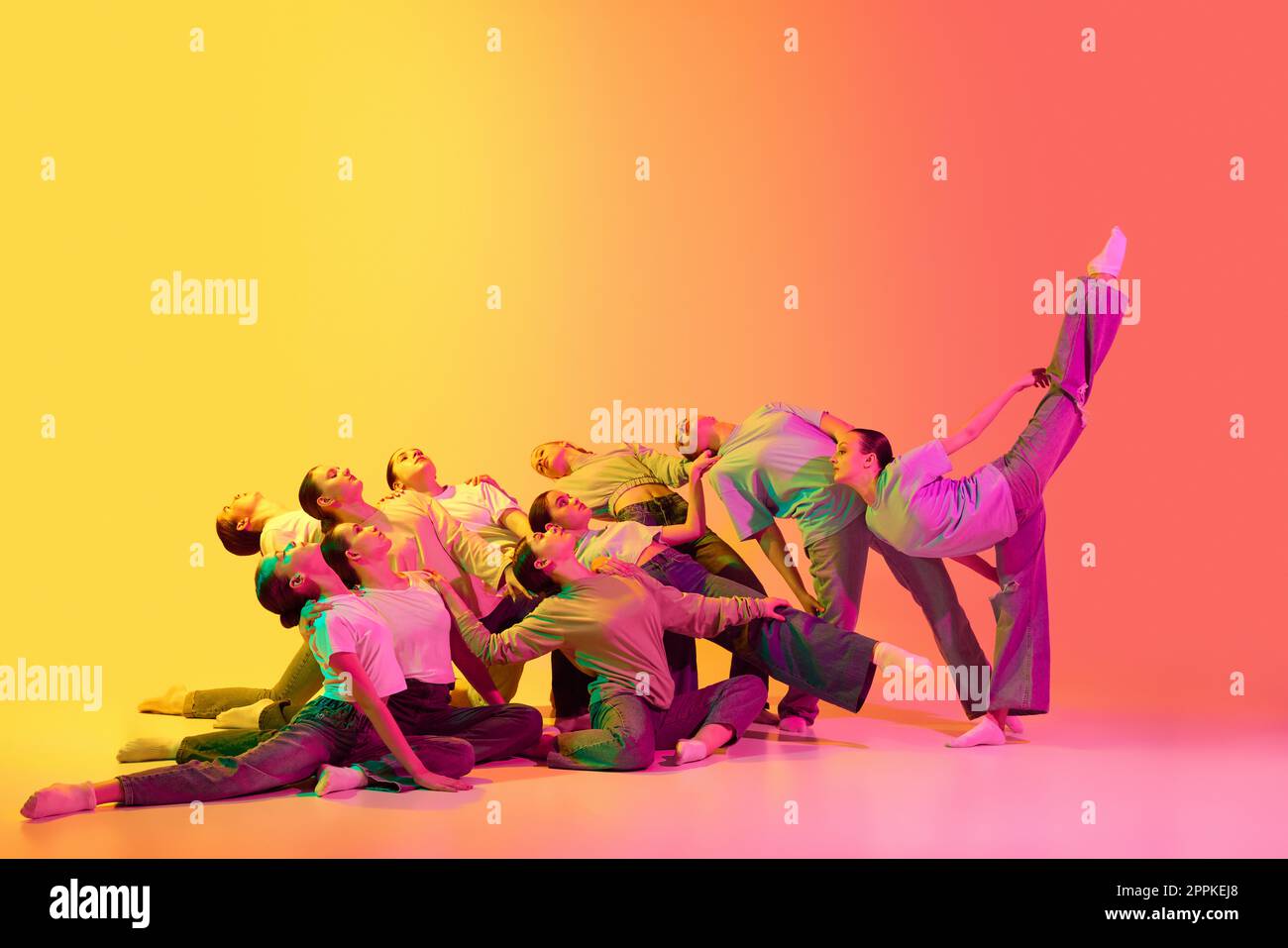 Group of pretty teenage girls wearing white t-shirt and jeans dancing ...