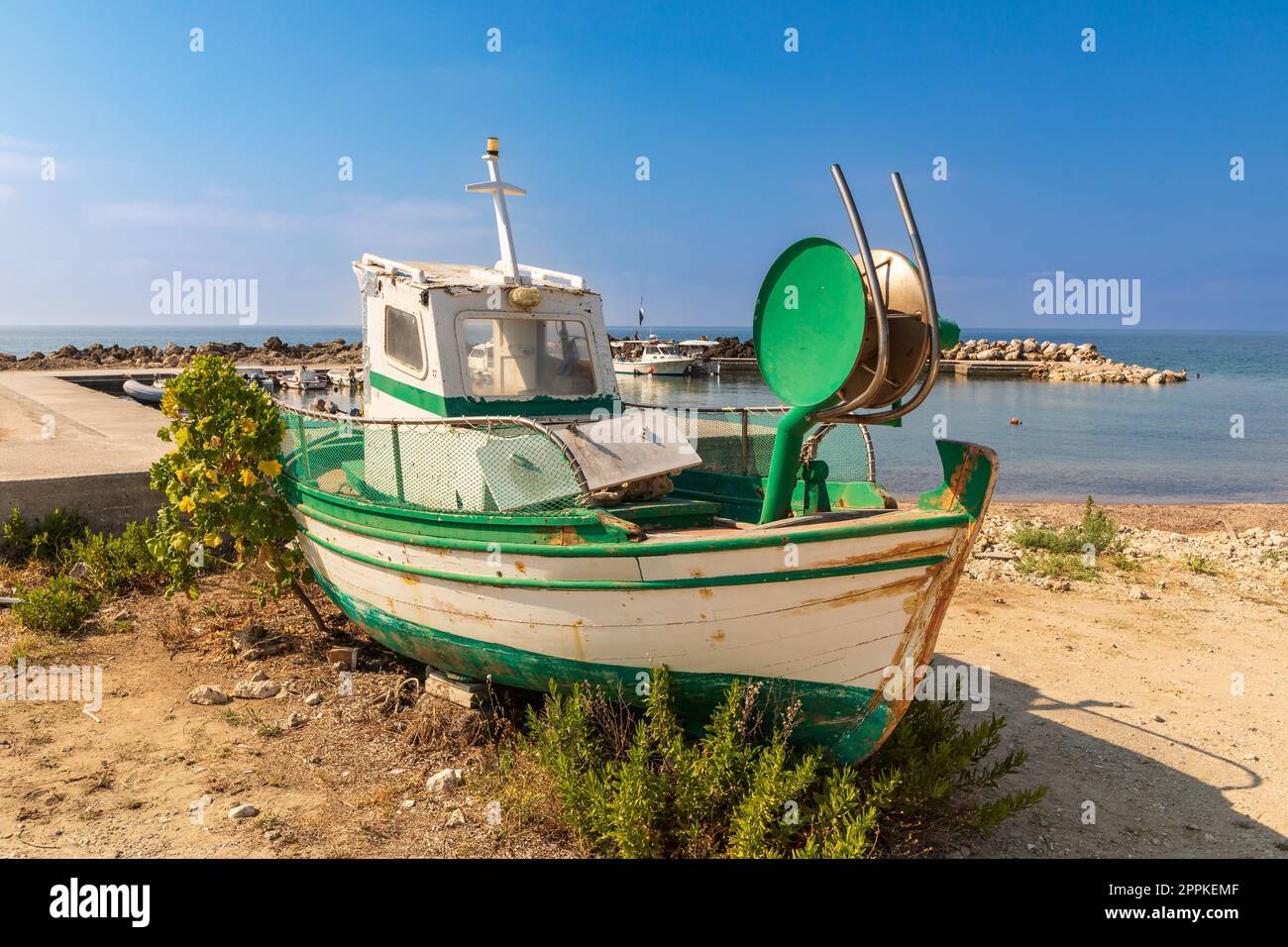 Grounded fishing boat in a small harbor on the island of Corfu, Greece ...