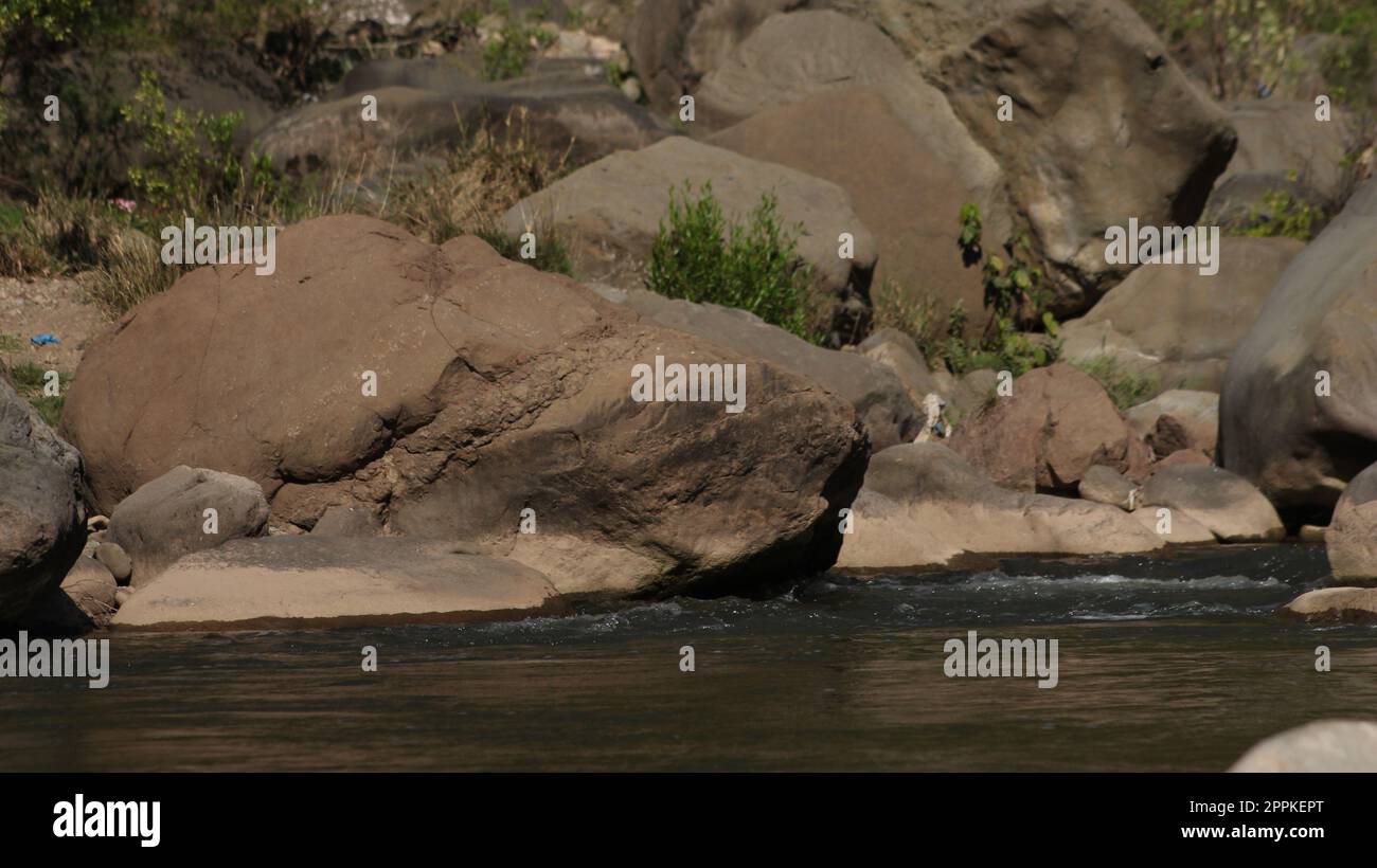 Coral rock wall water fountain Stock Photo - Alamy