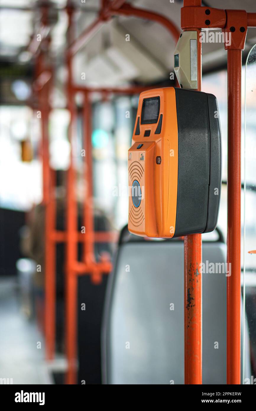 Ticket validator inside a public transportation bus Stock Photo - Alamy
