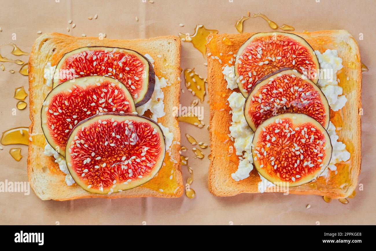 Sourdough wheat toast with ricotta cheese, fresh figs with honey and ...