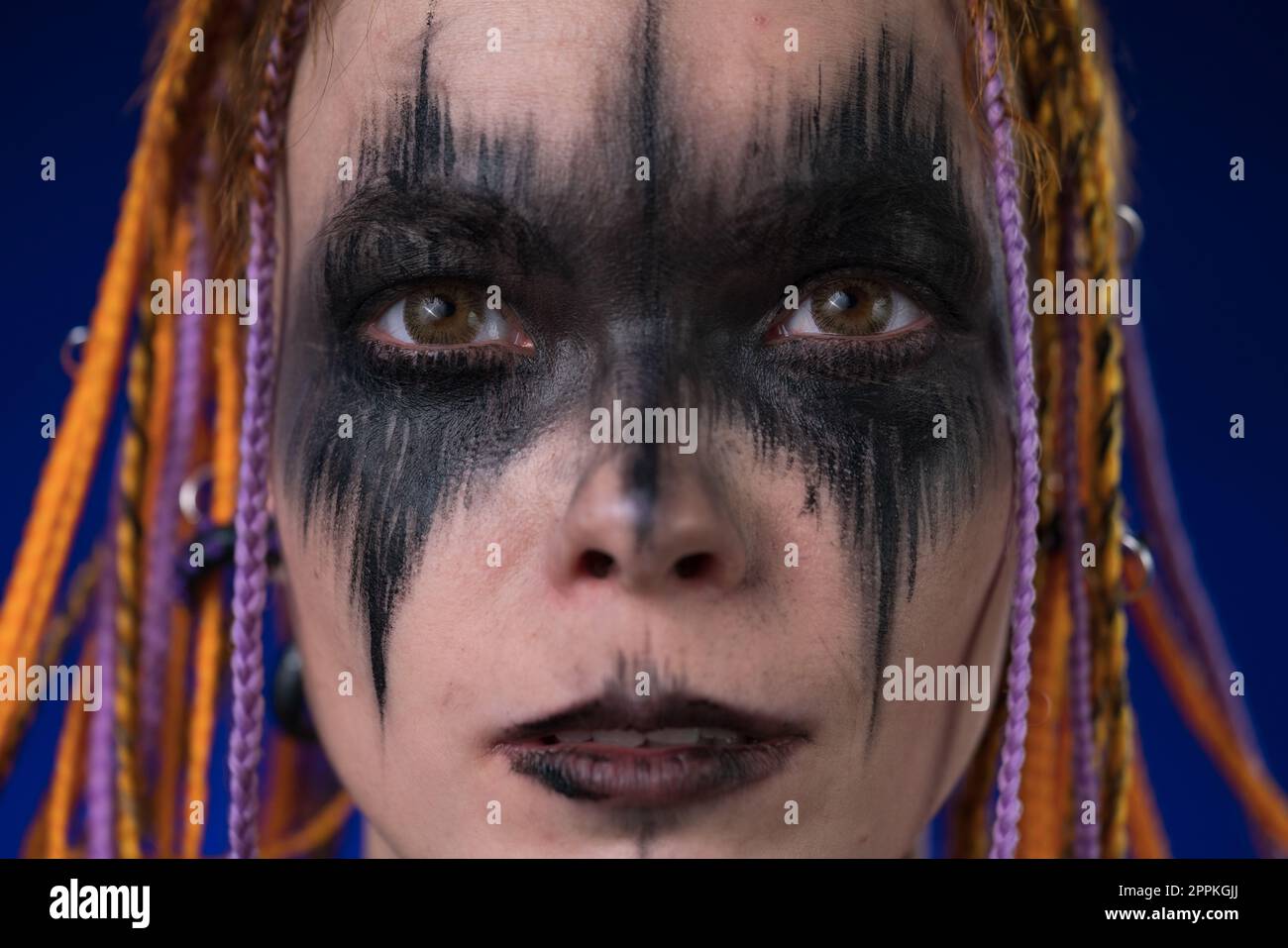 Fine art portrait of young woman with braids hairdo and horror black ...