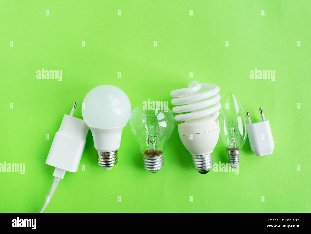 A set of different types of LED lamps isolated on a green background ...