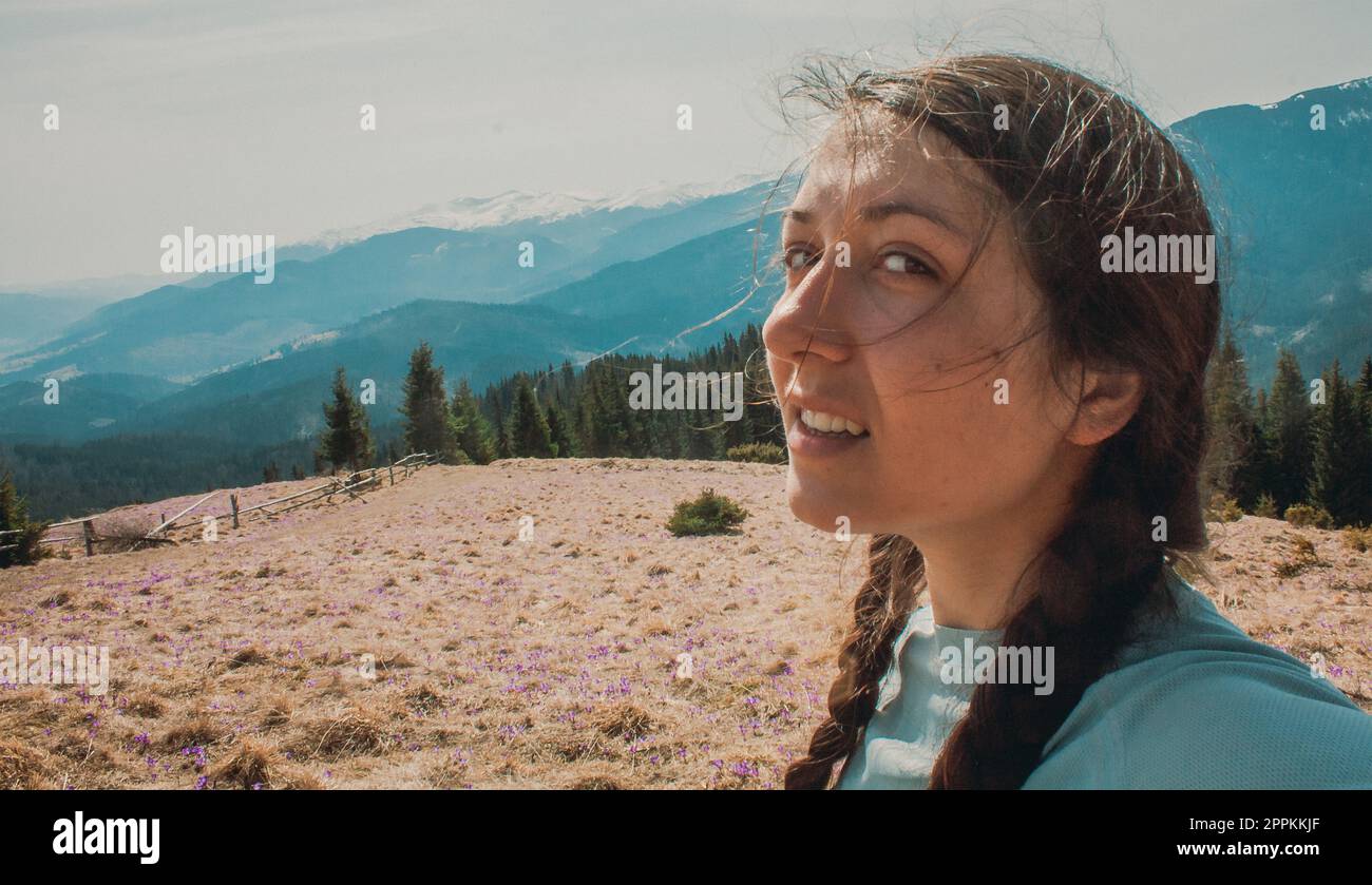 Close up young woman with disheveled hair looking sideways portrait ...
