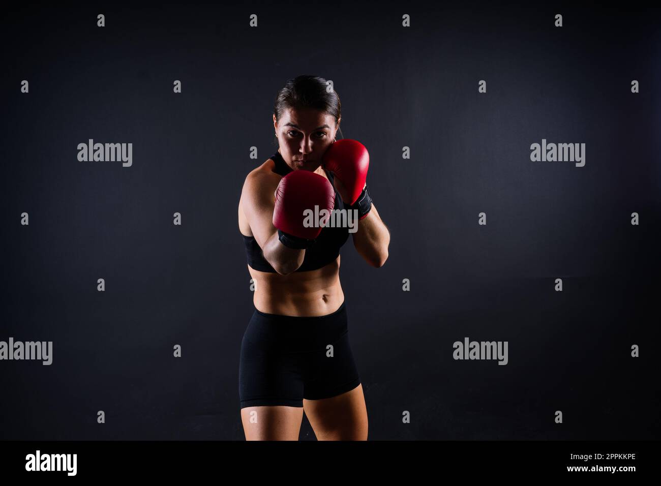 Athletic woman training high kick hi-res stock photography and images ...