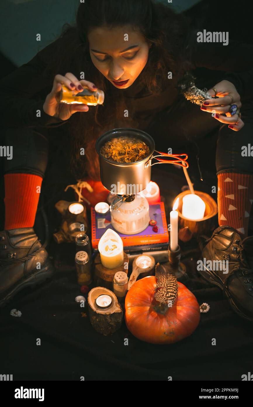 Close up woman witch brewing medicine in cauldron portrait picture ...