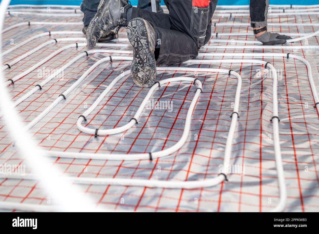 installation of underfloor heating in a new building Stock Photo - Alamy