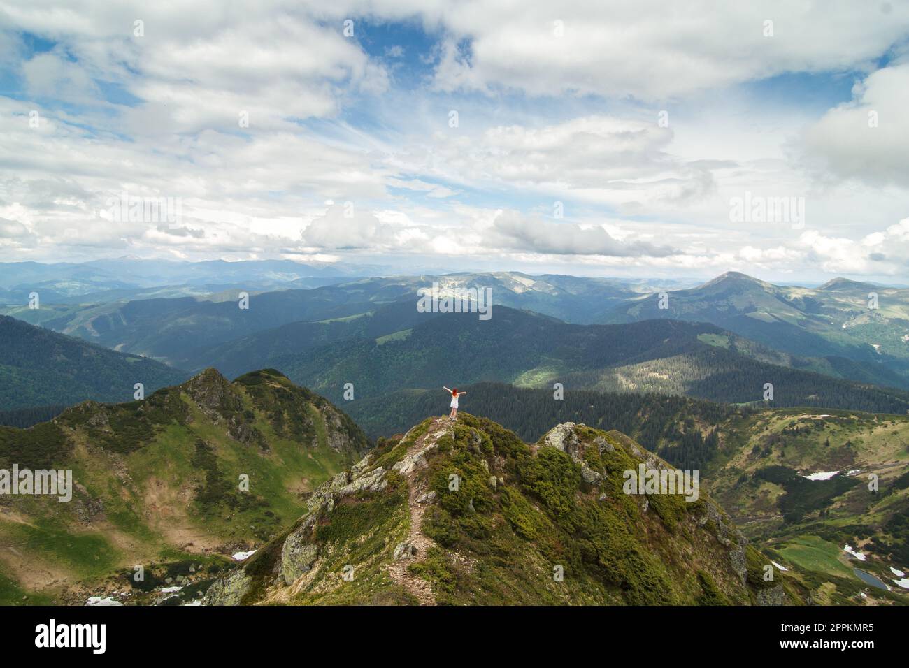 Happy woman on highest ridge top landscape photo Stock Photo - Alamy
