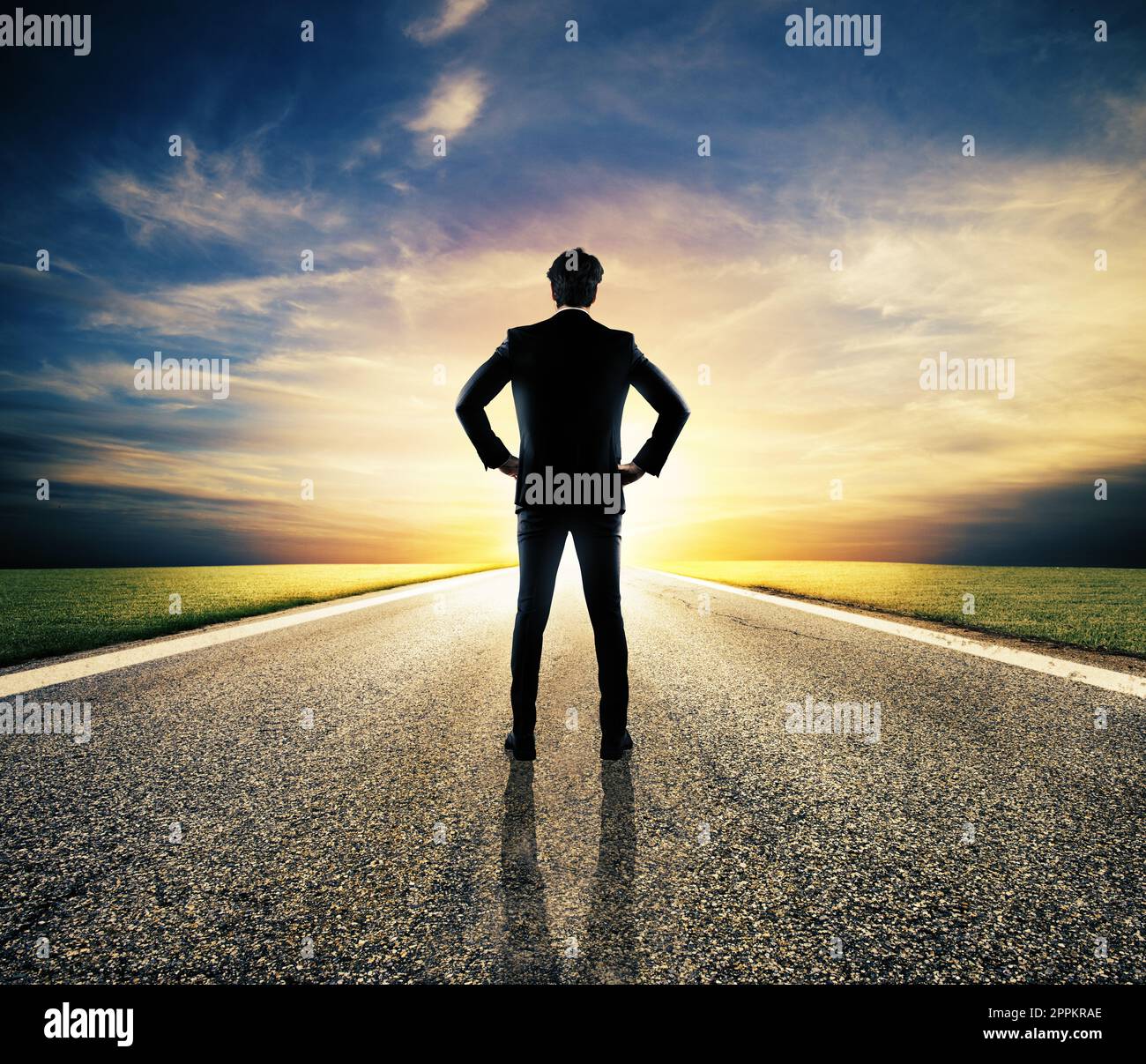 Businessman walks on an unknown road for a new adventure Stock Photo ...