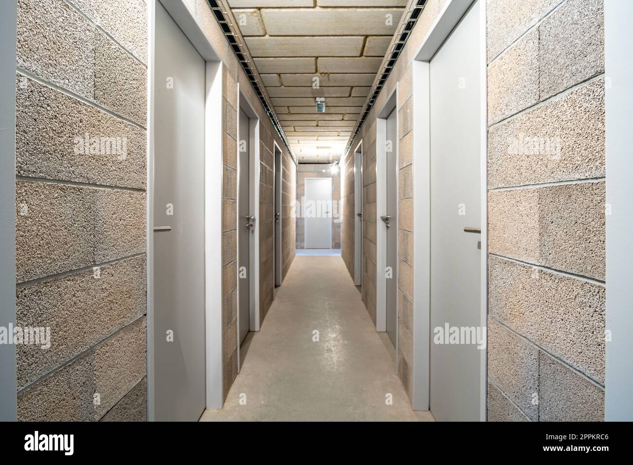 basement space in a new apartment building. corridor with a doors Stock ...