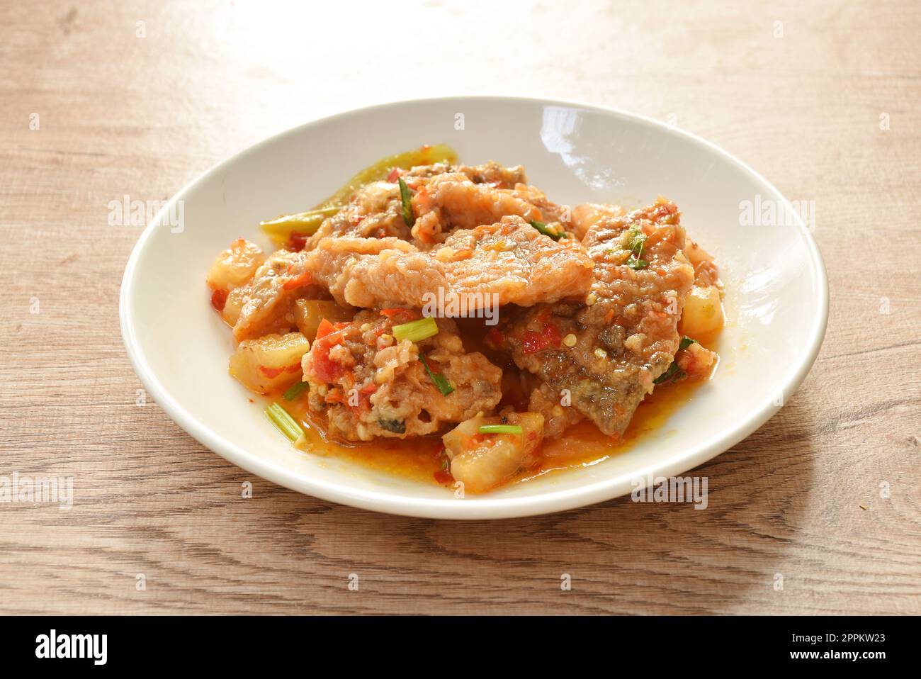 deep fried slice mango fish with pineapple and chili in sweet sour ...