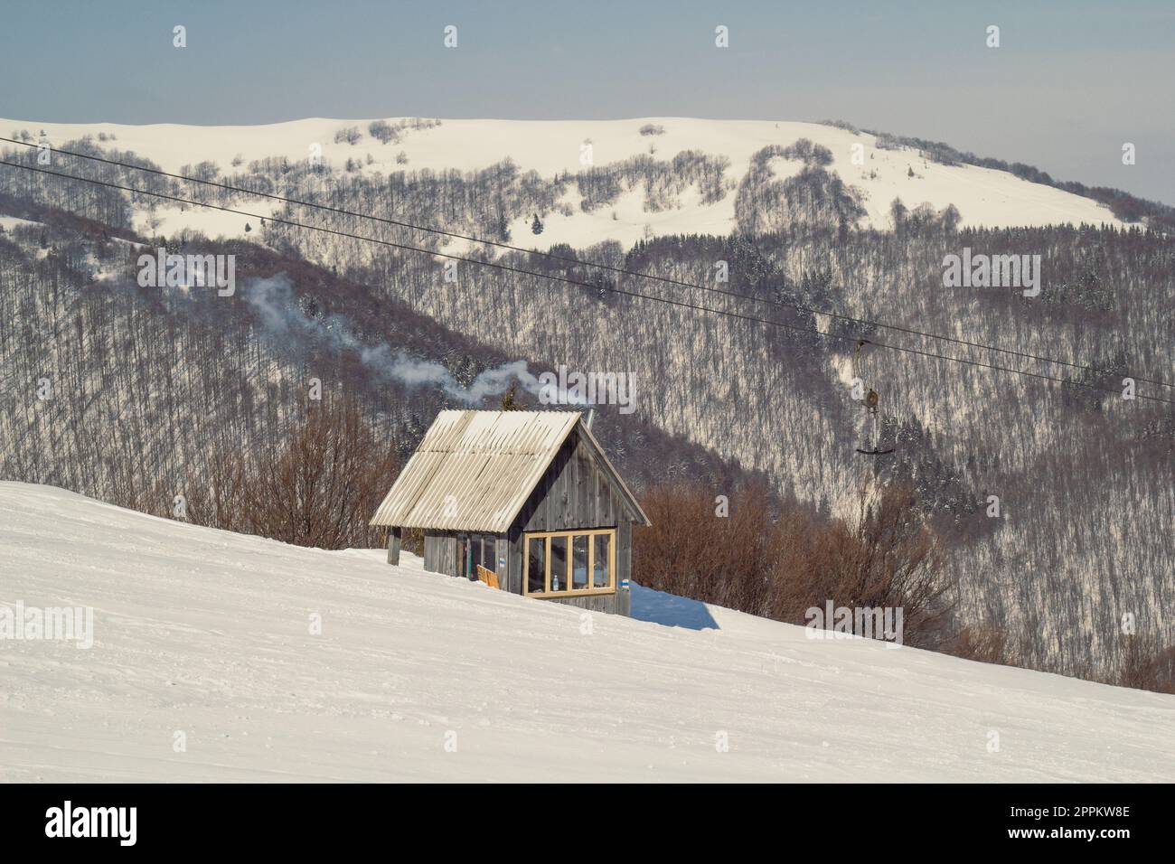 Wooden cabin on mountain slope landscape photo Stock Photo - Alamy