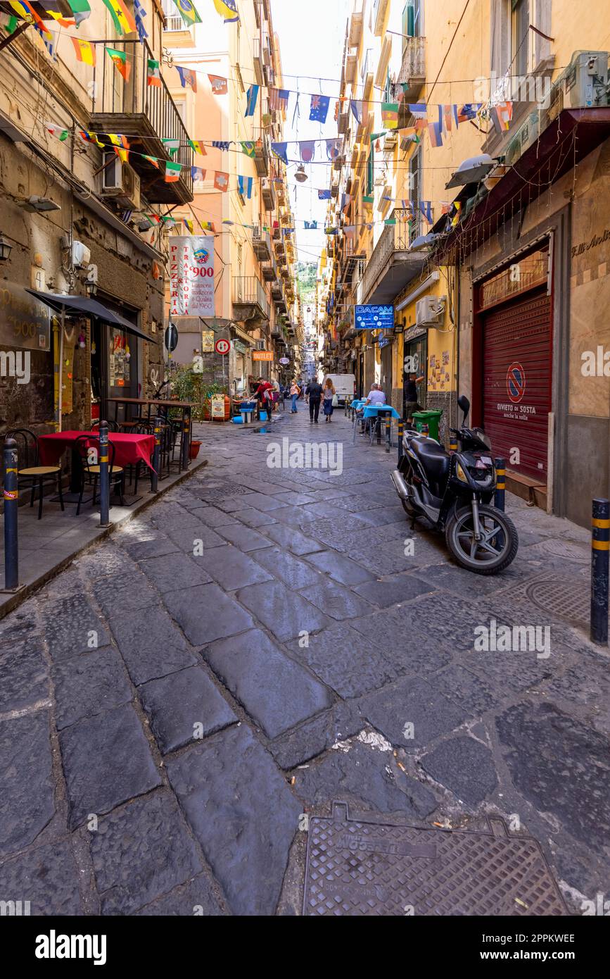 A typical Italian cityscape, colorful buildings, narrow street, Naples ...