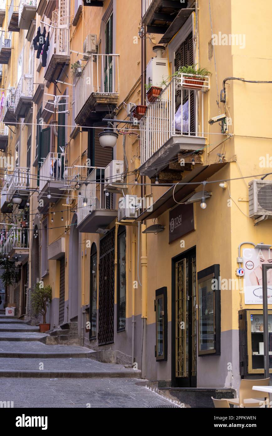 A typical Italian cityscape, colorful buildings, narrow street, Naples ...
