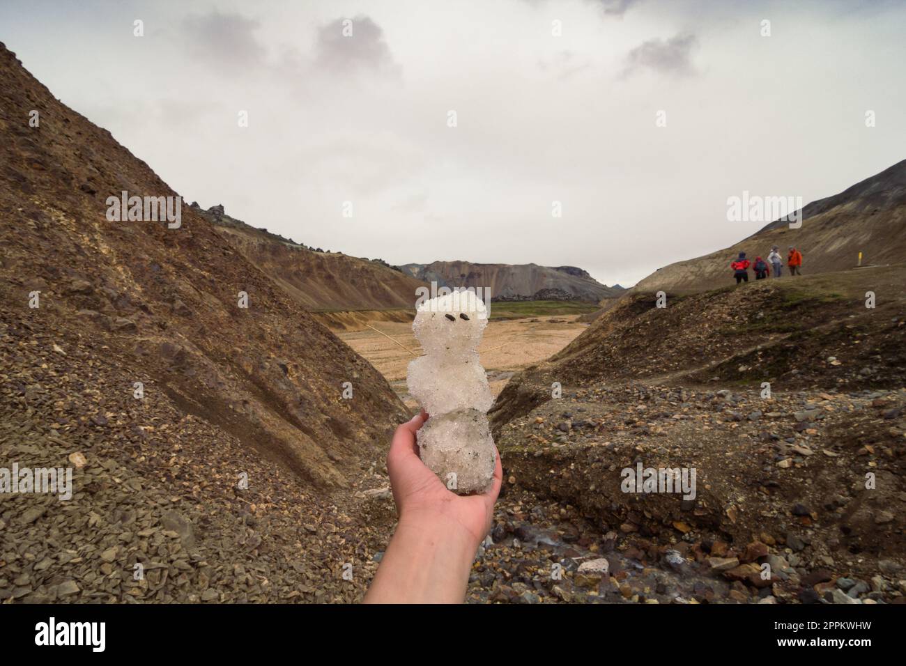 Close up hand holding snowman concept photo Stock Photo - Alamy
