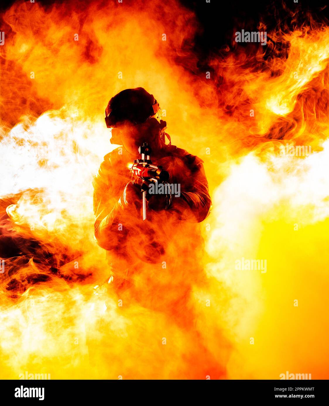 Soldier in fire and smoke Stock Photo - Alamy