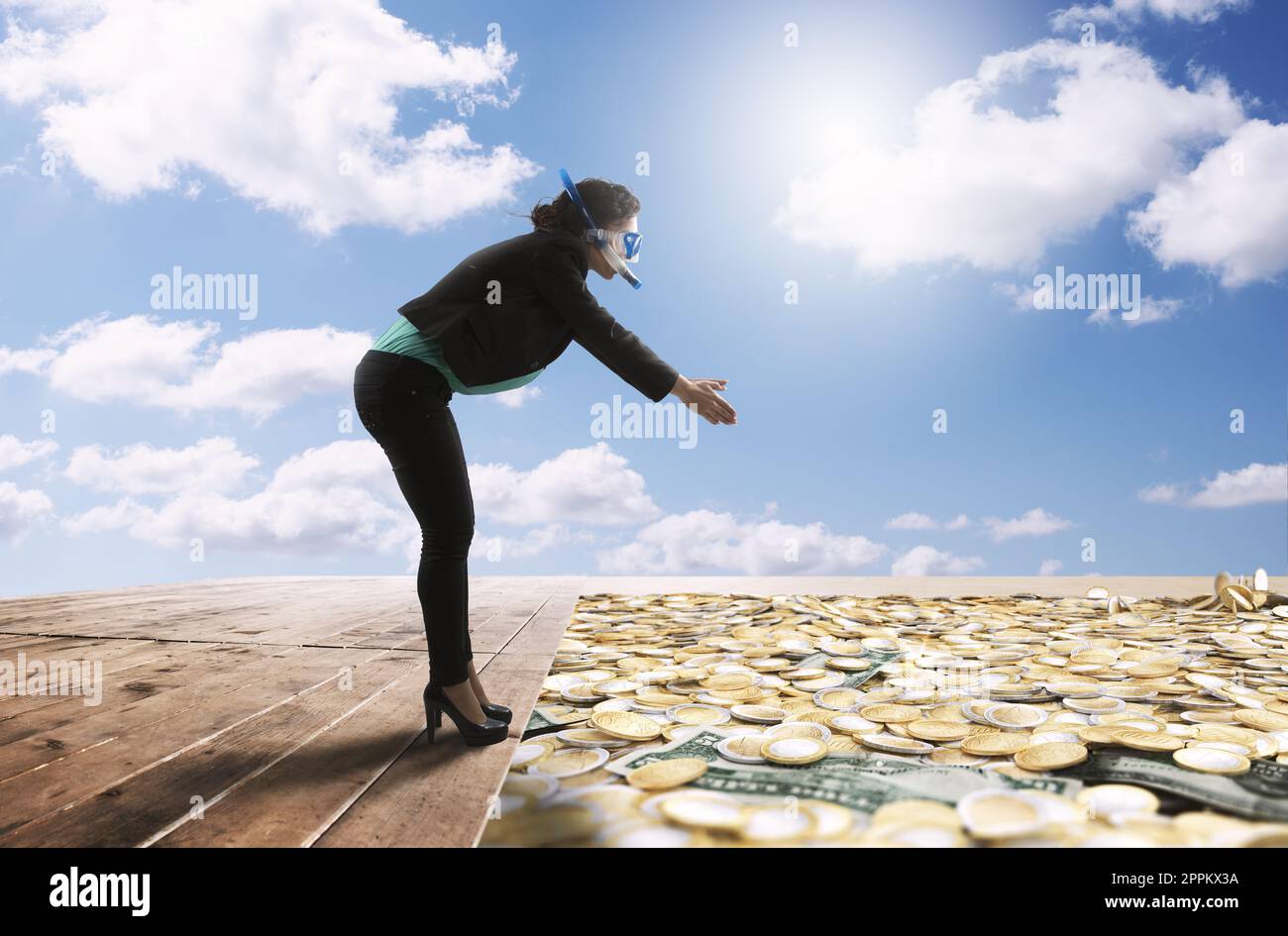 Businesswoman is ready to dip in a big swimming pool full of coin and ...