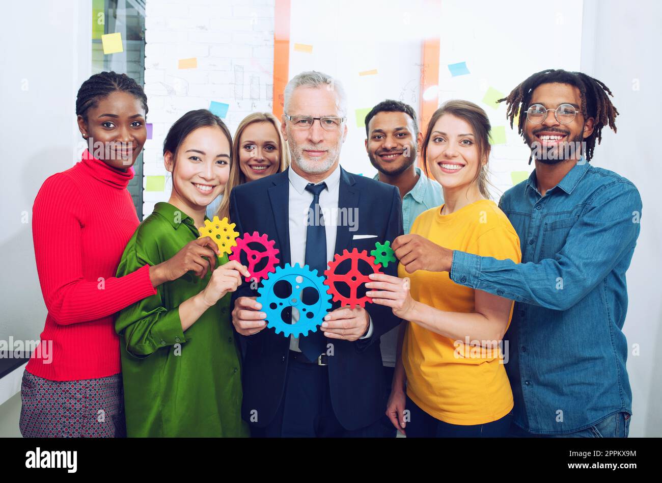 Business team connect pieces of gears. Teamwork, partnership and ...