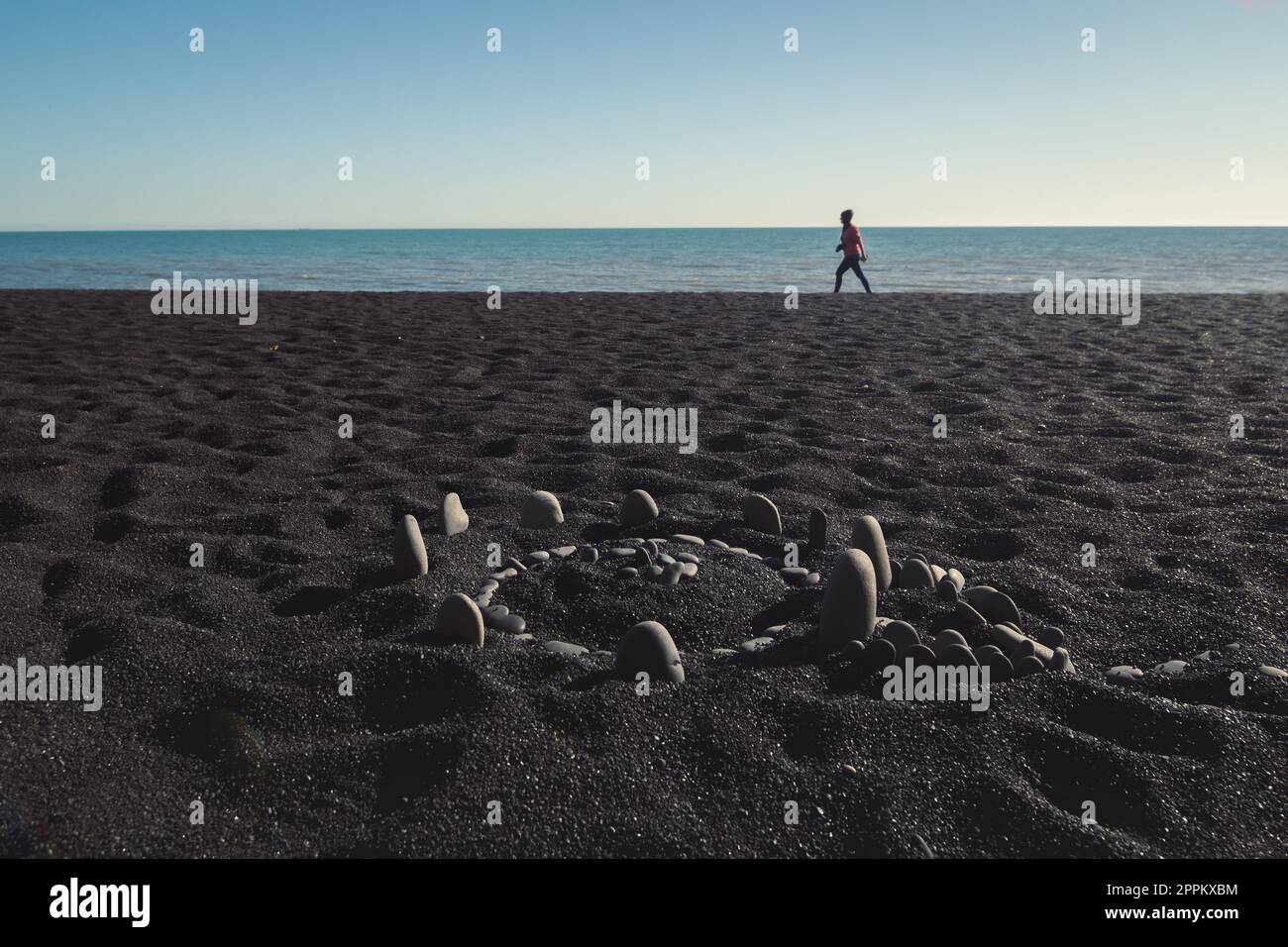 Close up circle with pebbles on beach concept photo Stock Photo - Alamy