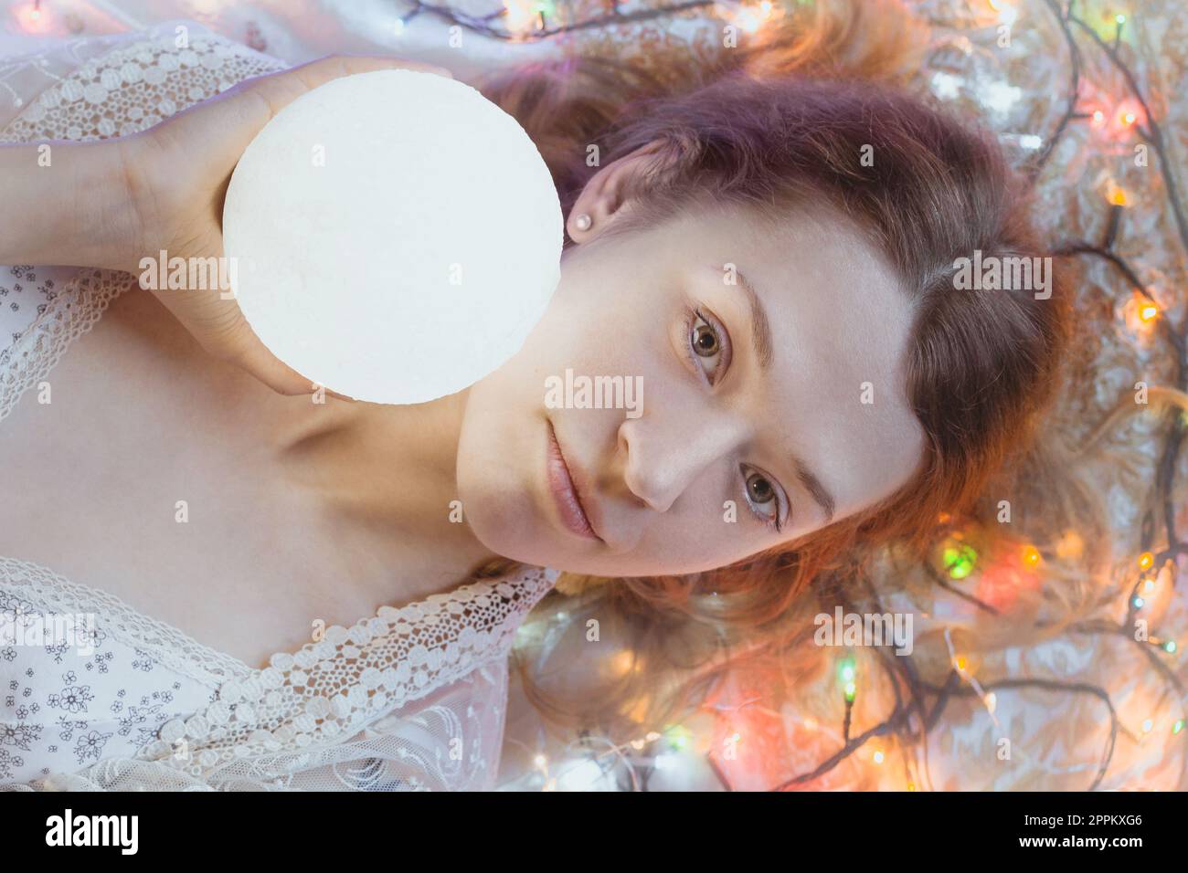 Close up glowing orb illuminating woman face portrait picture Stock ...