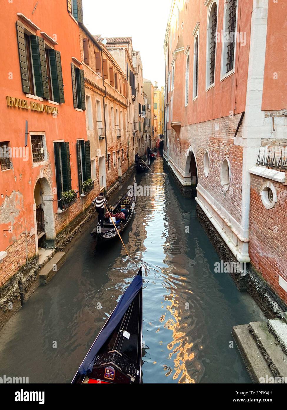 gondolas floats along narrow canal in Venice Stock Photo - Alamy
