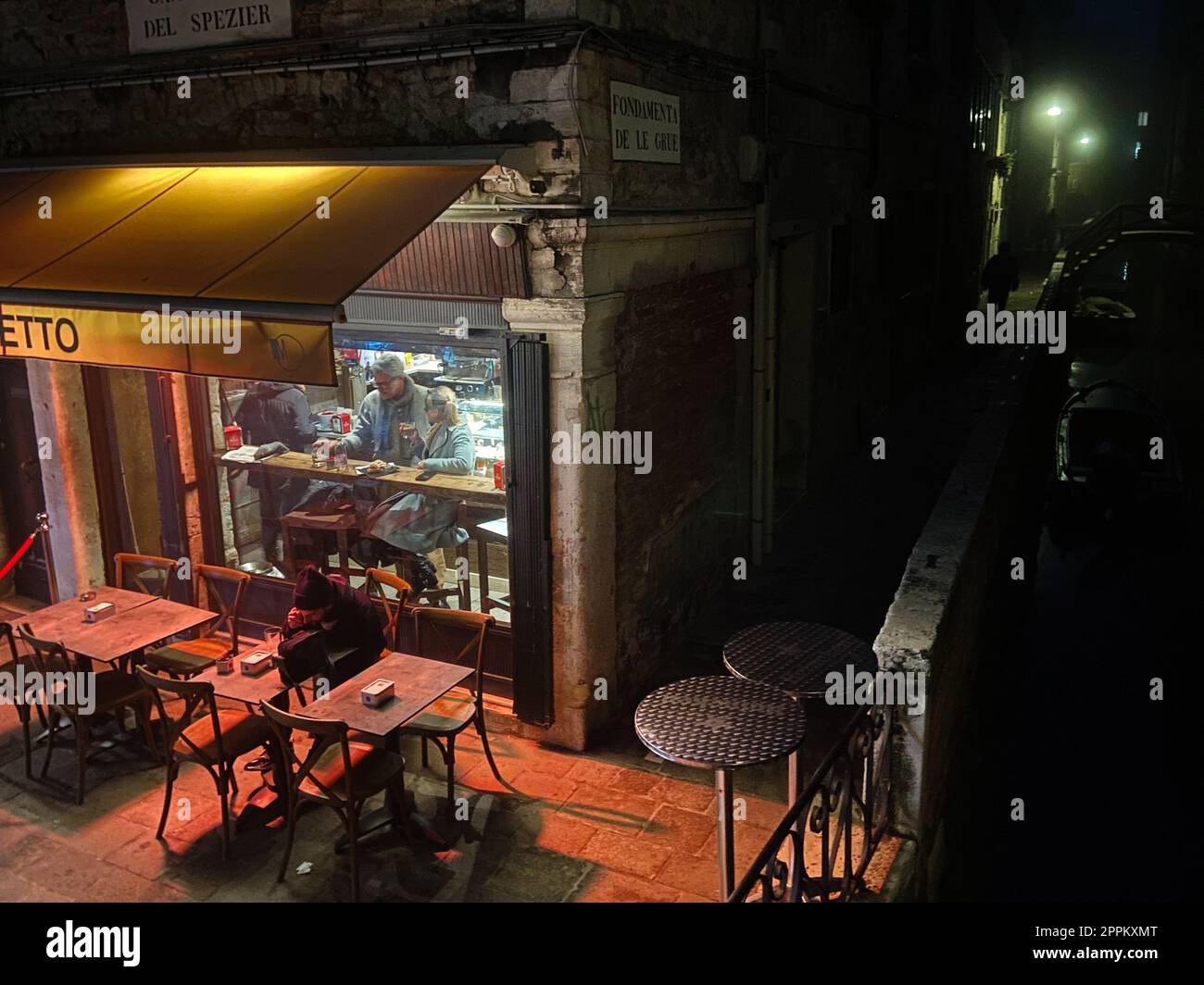 above view of illuminated cafe in winter night Stock Photo - Alamy