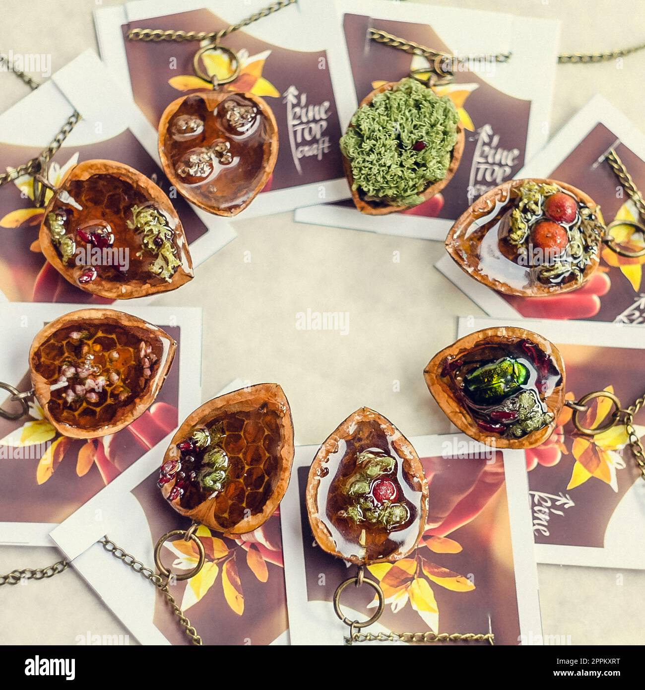 Close up pendants made of walnuts with floral details photo Stock Photo ...