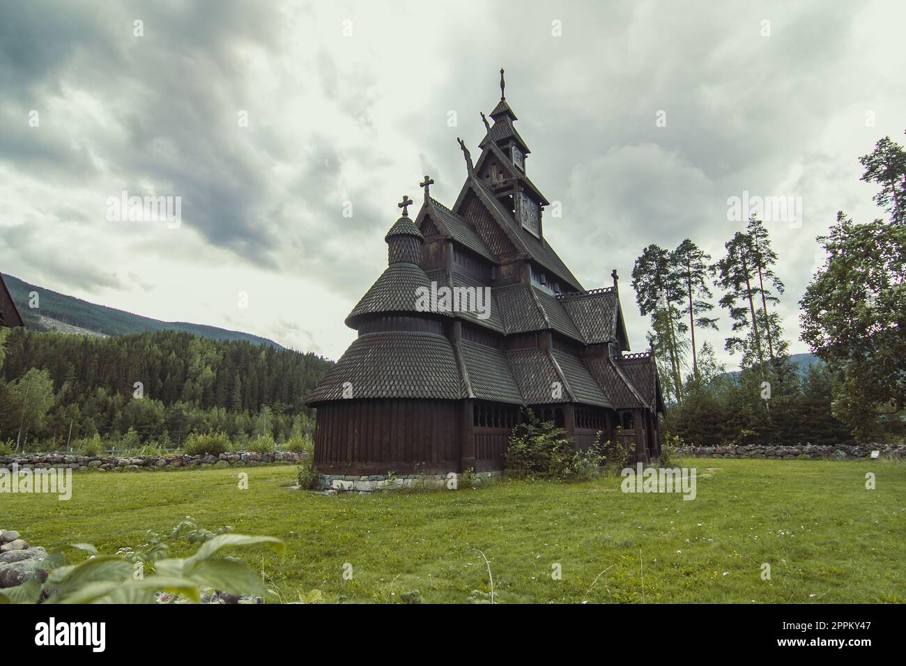 Ancient wooden church in Norway landscape photo Stock Photo - Alamy