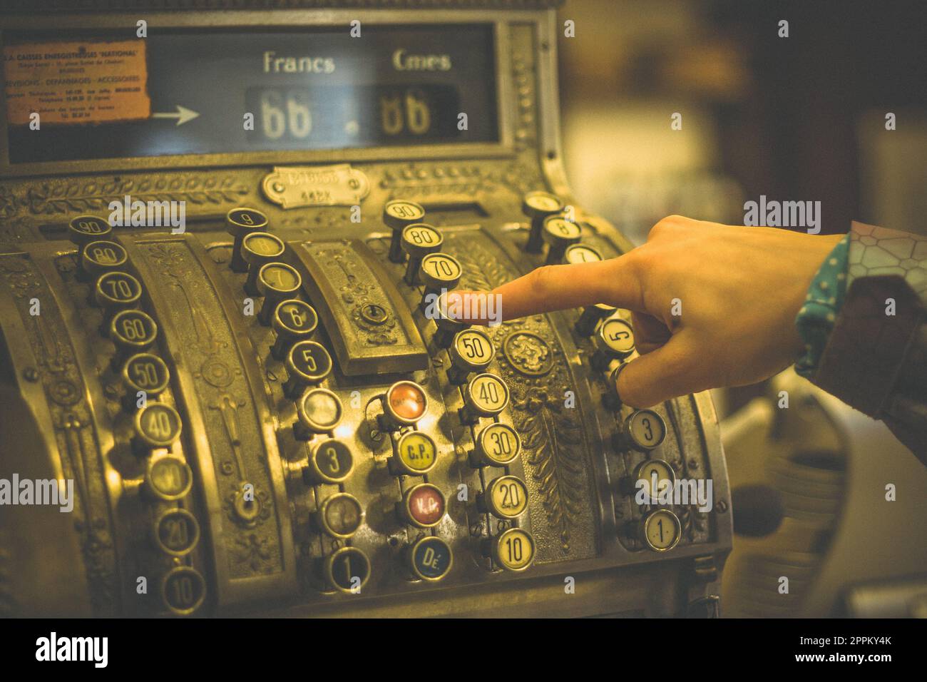 Close up woman pressing key of old cash register concept photo Stock ...