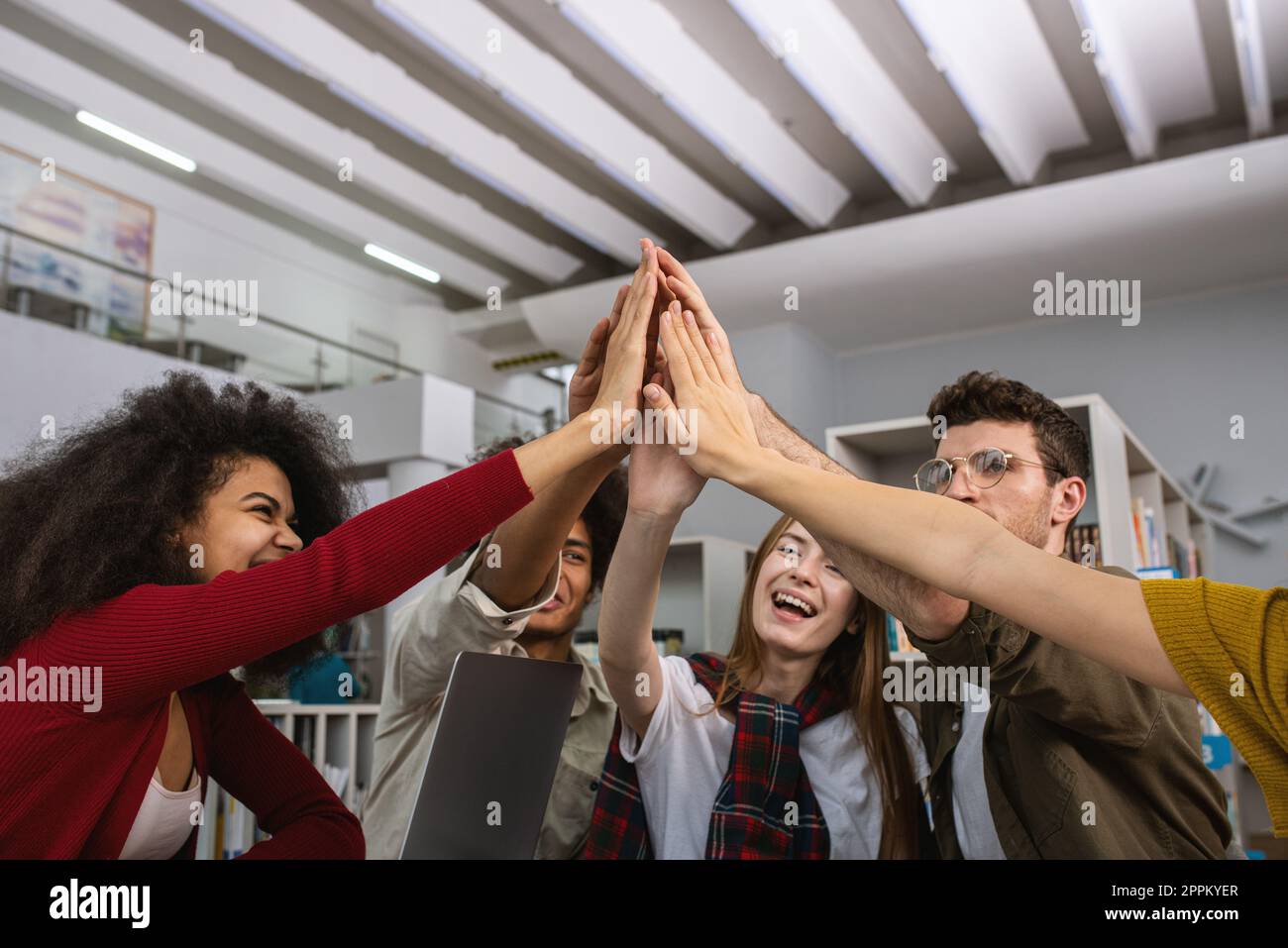 Office joining hand together hi-res stock photography and images - Alamy