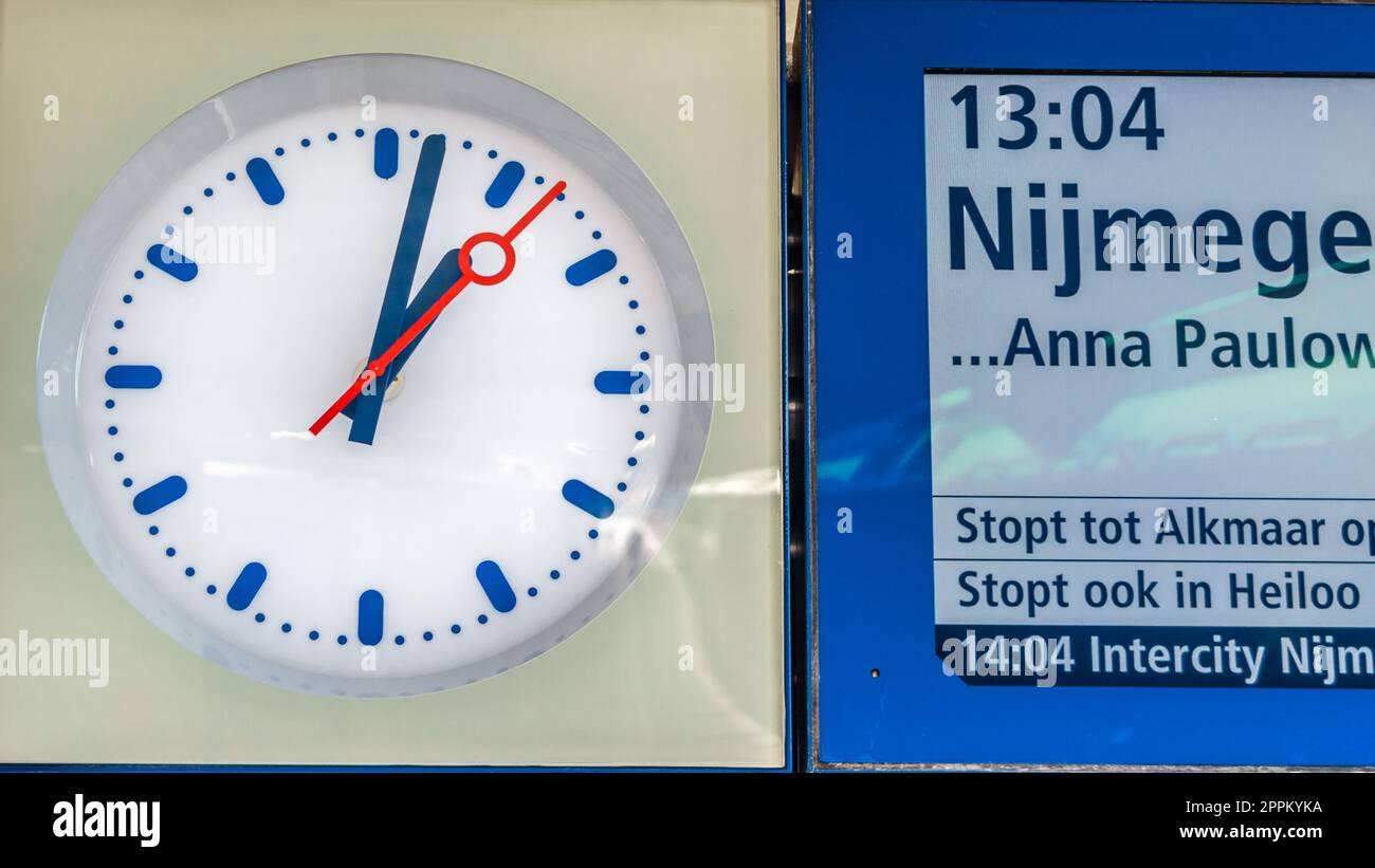 DEN HELDER, THE NETHERLANDS - AUGUST 25, 2013: Clock and sign ...