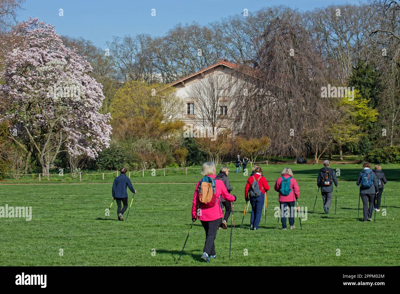 LYON, FRANCE, March 28, 2023 : A group of women practice Nordic walking ...