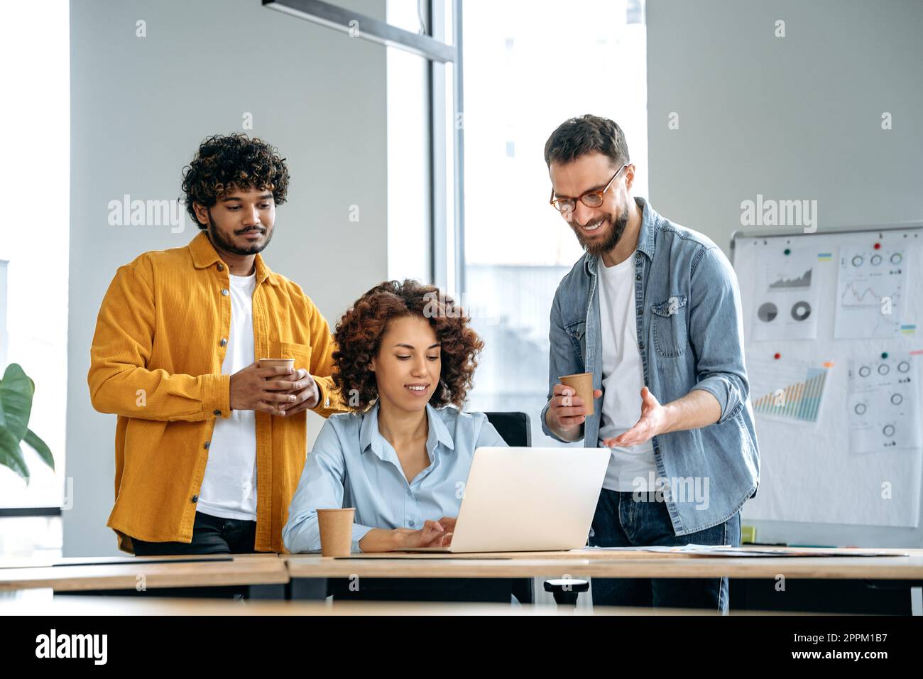 Creative group of successful multiracial business people, working ...