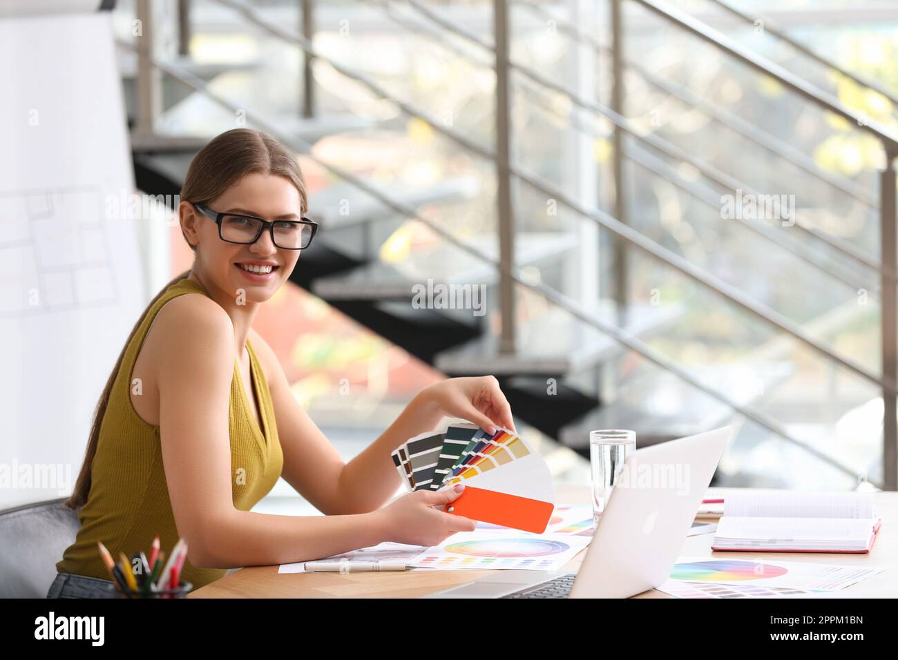 Professional interior designer at workplace in office Stock Photo - Alamy