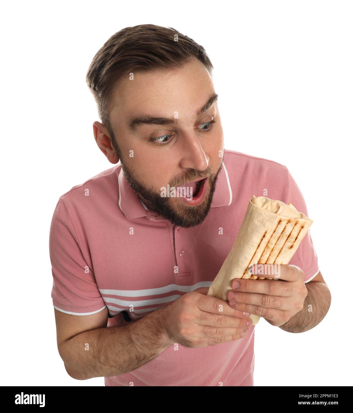 Emotional young man with delicious shawarma on white background Stock ...