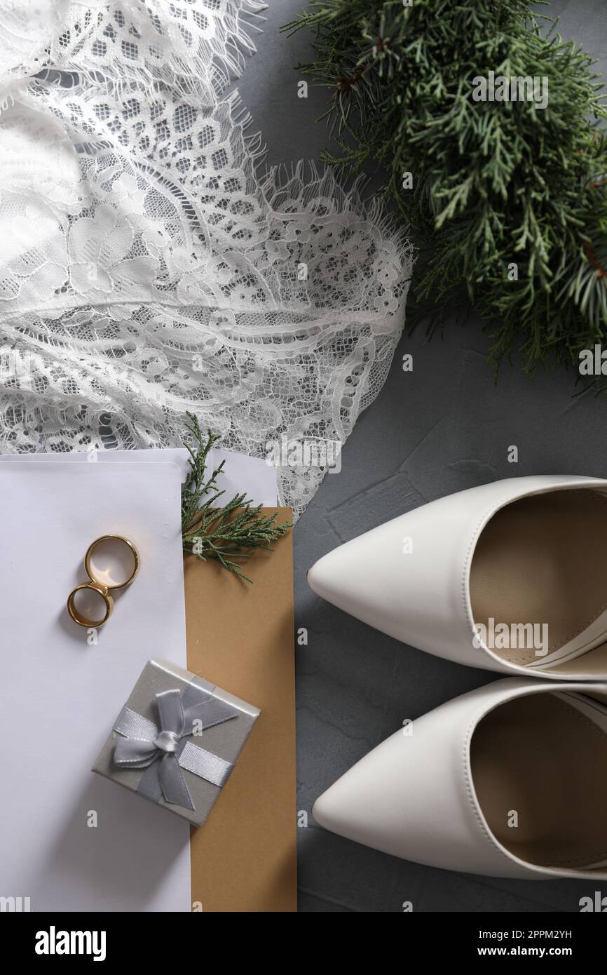 Flat lay composition with wedding dress, white high heel shoes and ...