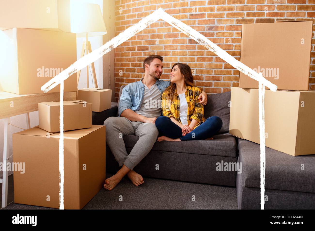 Happy couple have to move and arrange all the packages. Concept of ...
