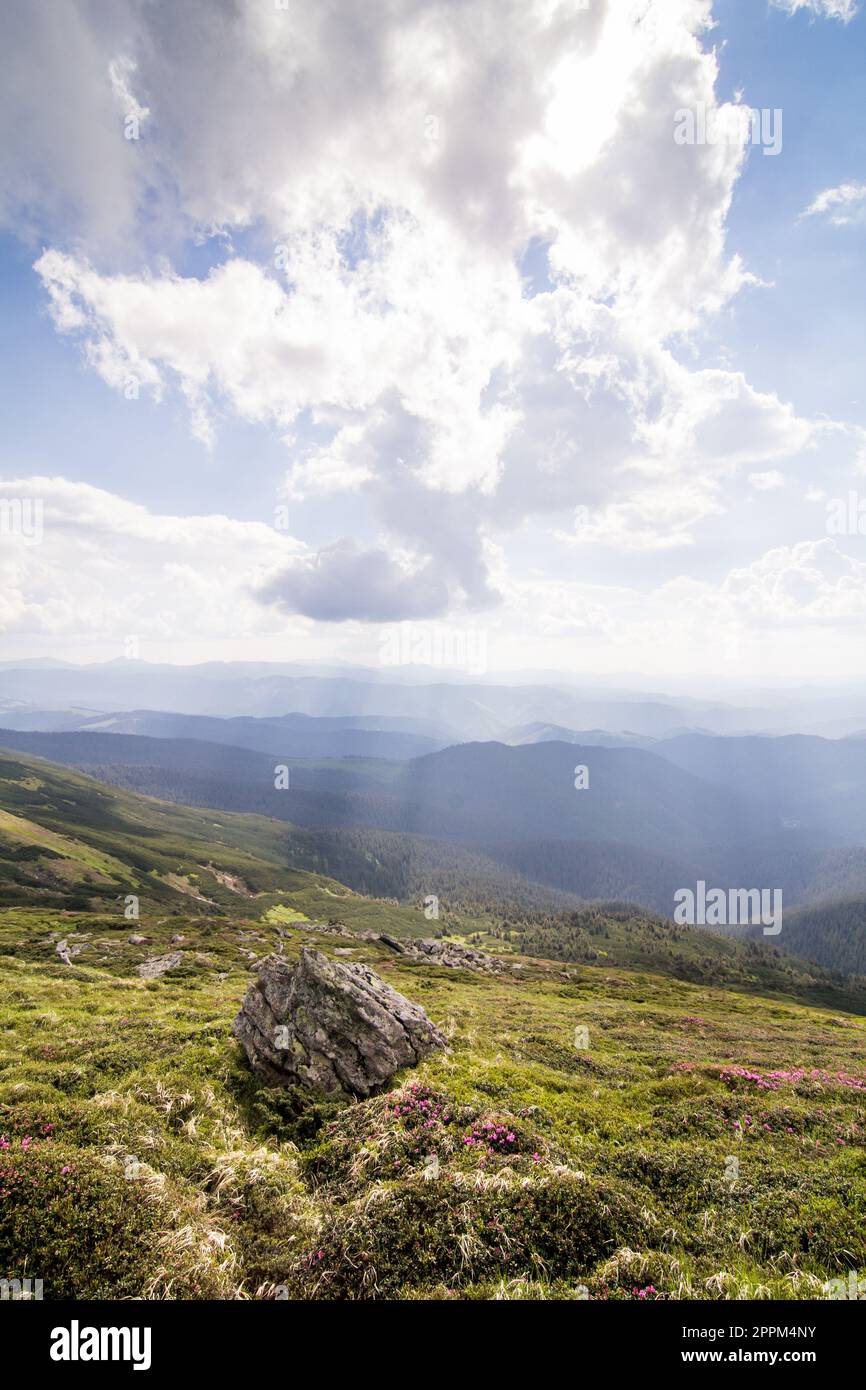 Sunlight falling on mountain hill landscape photo Stock Photo - Alamy