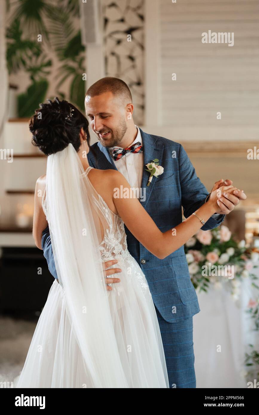 the first dance of the bride and groom inside a restauran Stock Photo ...