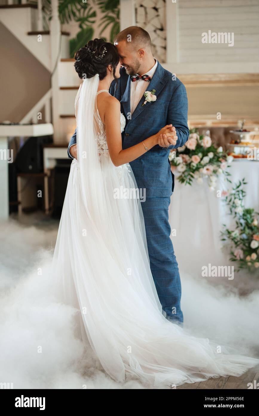 the first dance of the bride and groom inside a restauran Stock Photo ...