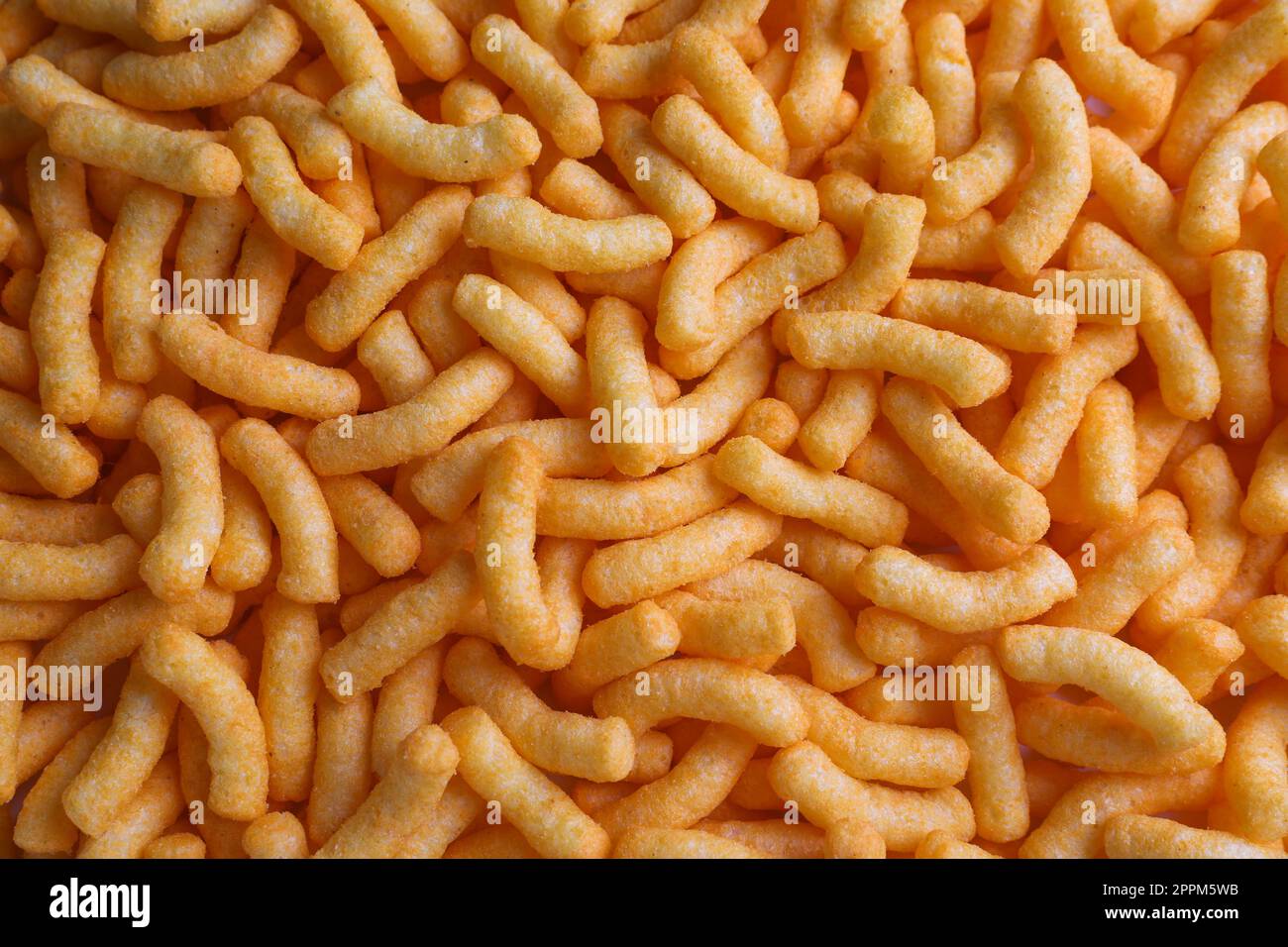Crunchy cheese puffs hi-res stock photography and images - Alamy