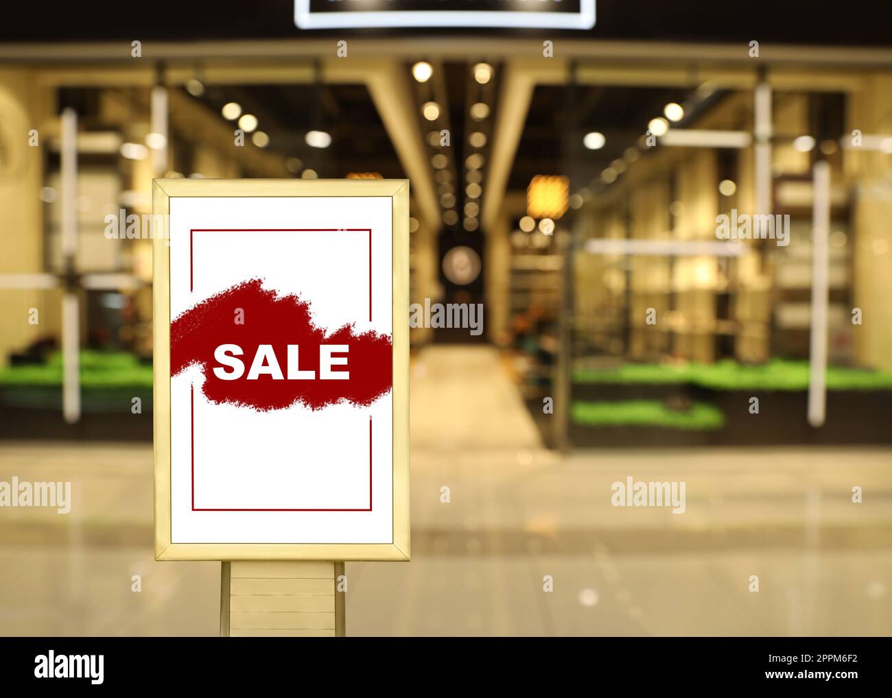 Advertising board with text SALE in shopping mall. Special promotion ...