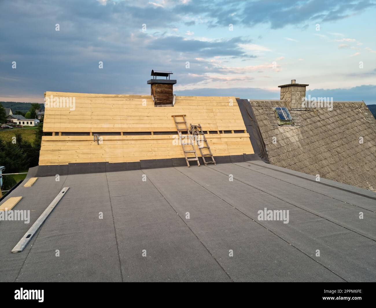 Installation of new roof boards at construction the assembled roof on ...