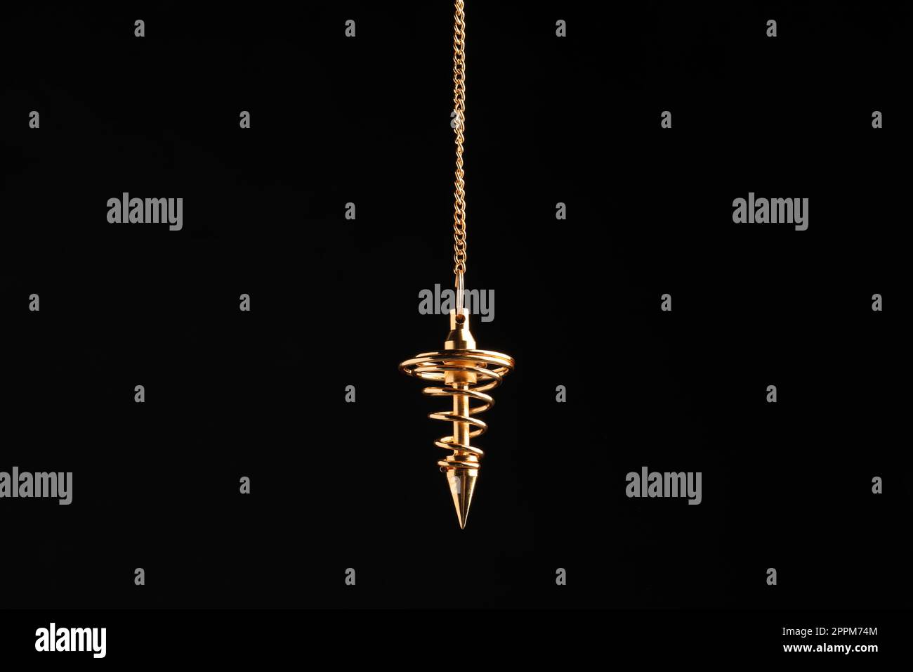 Beautiful golden pendulum with chain on black background. Hypnosis ...