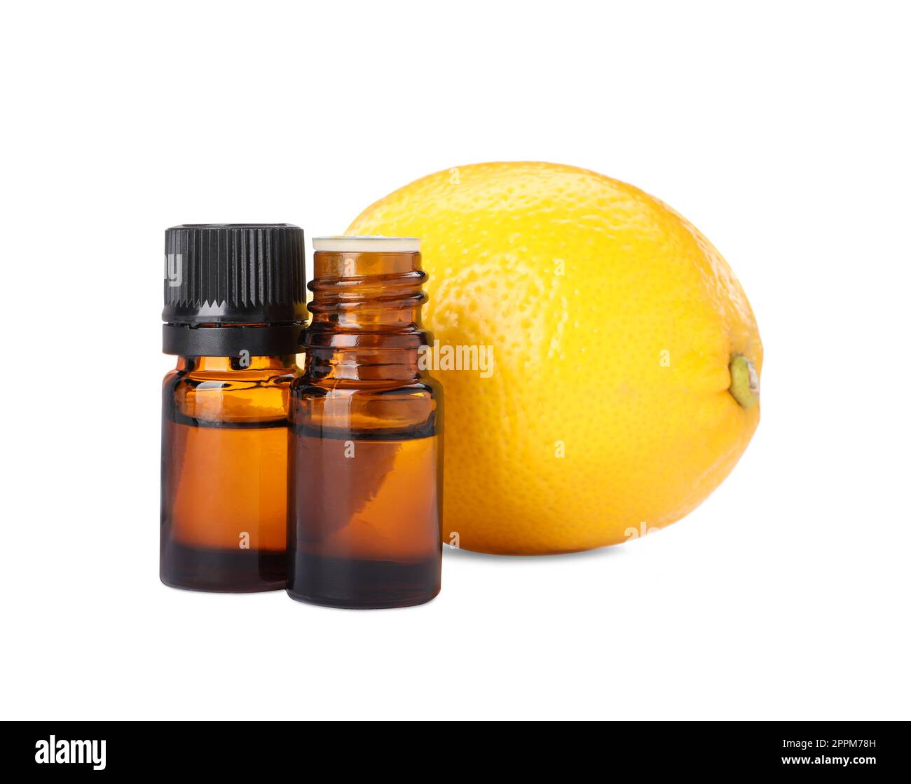 Bottles of citrus essential oil and fresh lemon isolated on white Stock ...