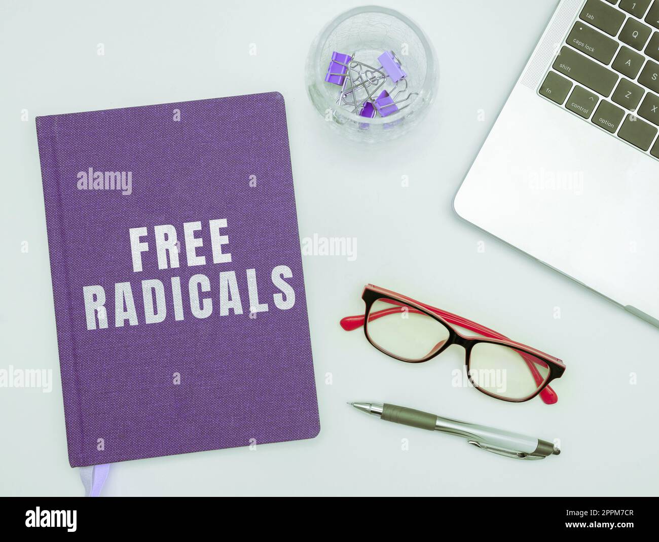 Hand writing sign Free Radicals. Concept meaning produced in body by ...