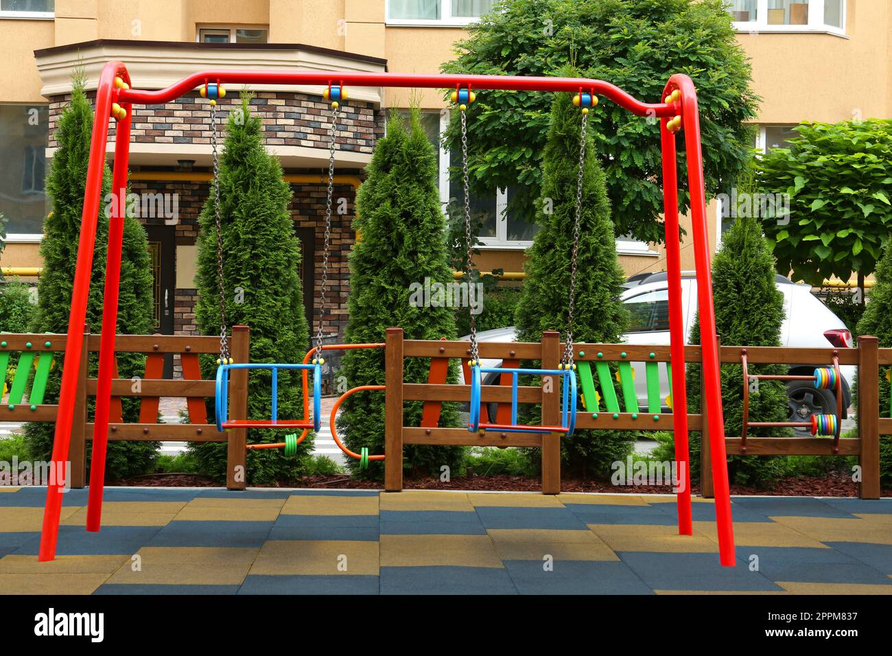 Empty outdoor children's playground with swings in residential area ...